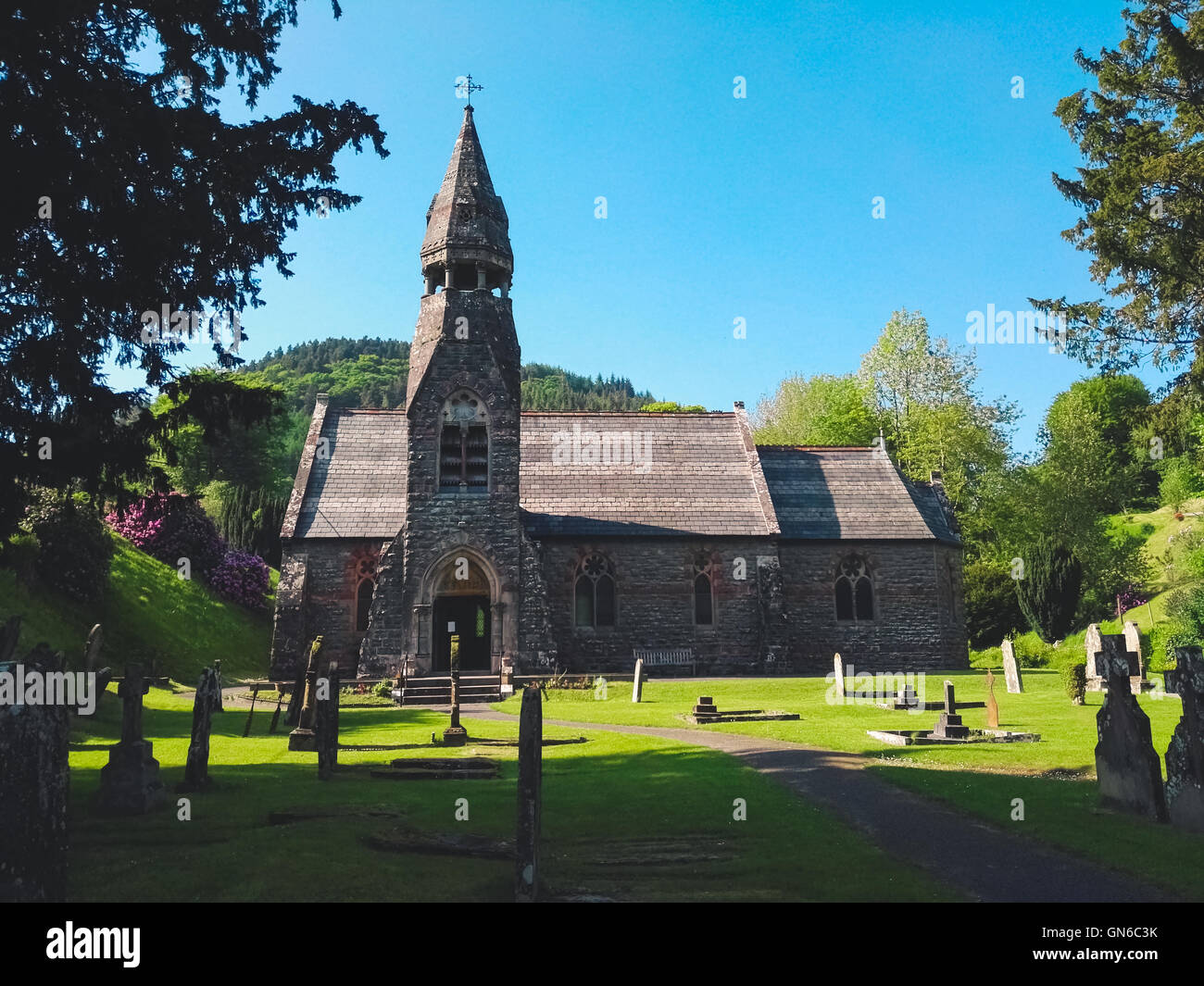 Small abbey and cemetery Stock Photo - Alamy