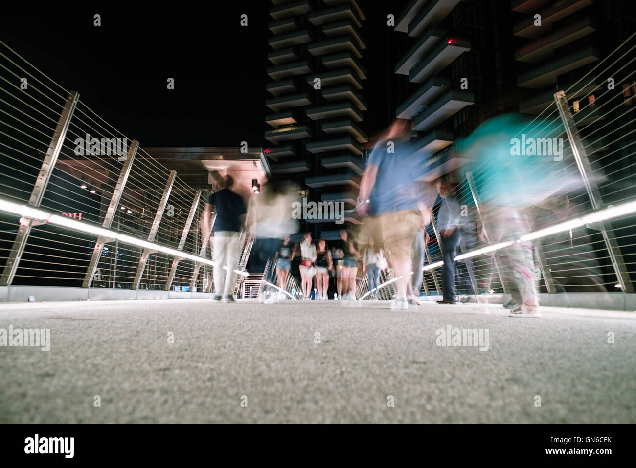 Fast people on a footbridge in the modern city Stock Photo - Alamy