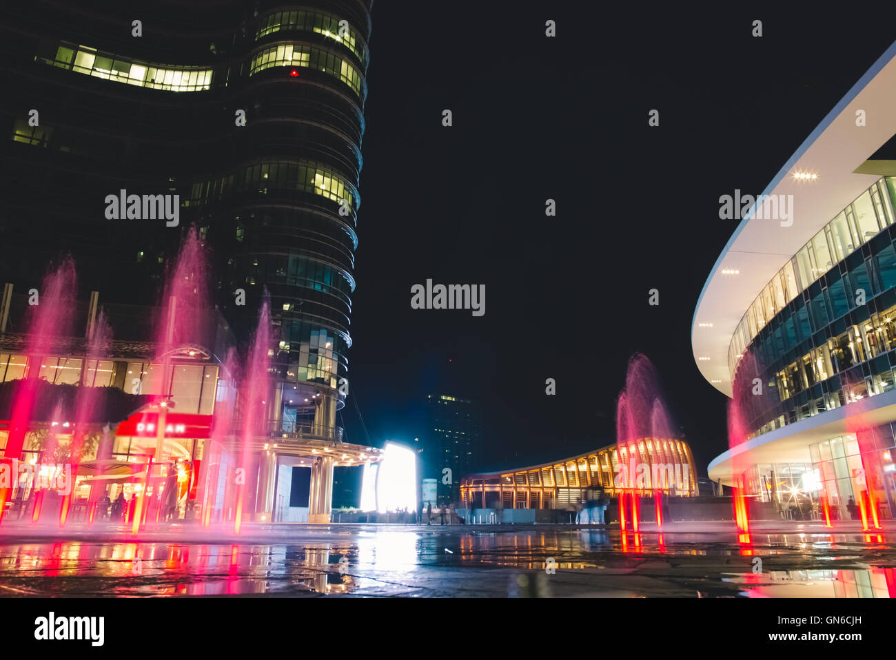 Modern Plaza and Colorful Fountains by Night Stock Photo - Alamy