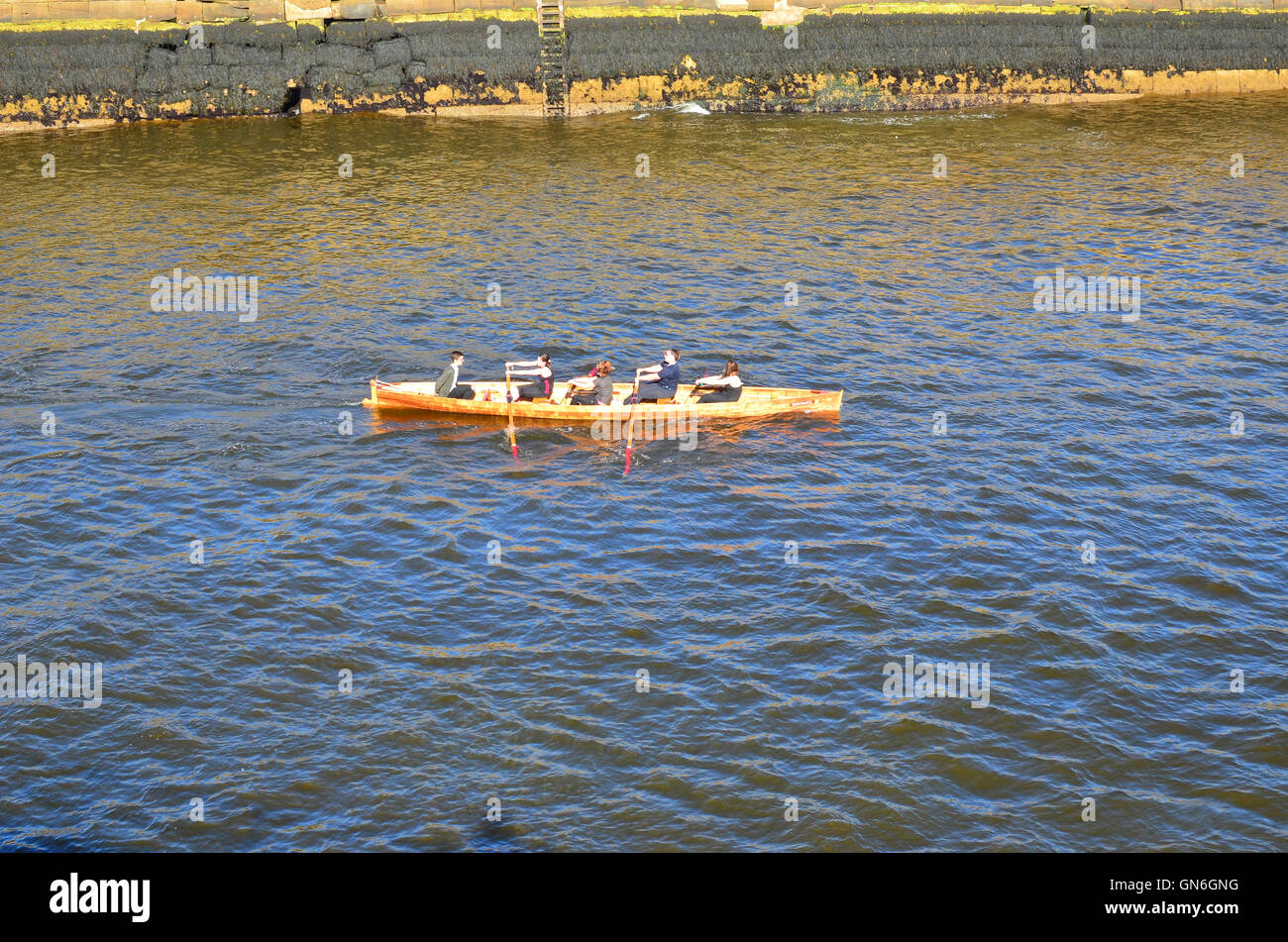 Rowing boat entering Whitby harbour North Yorkshire England UK Stock ...