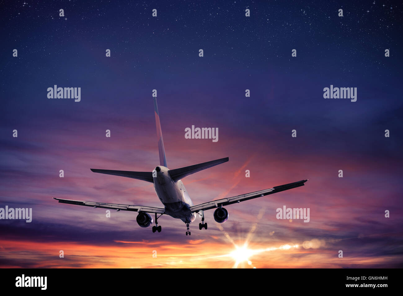 Sunset aircraft flight Stock Photo - Alamy