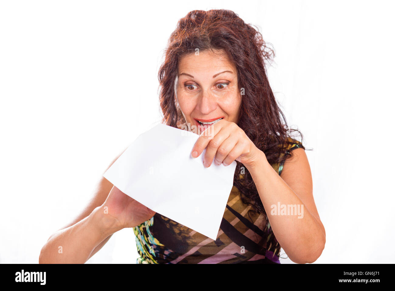 Happy mature woman with wrinkles and aging skin opening white envelopes ...
