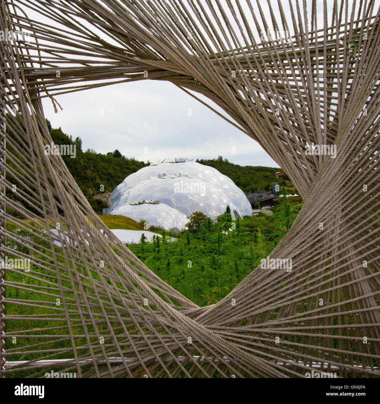 Biome at the Eden Project pictured through a weaved net fence Stock ...