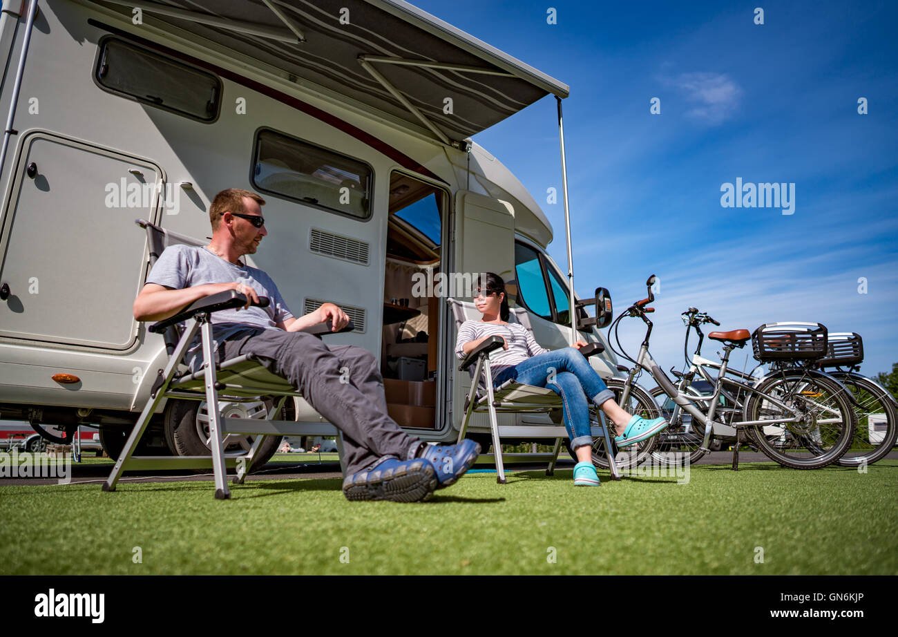 Couple on holiday at a campsite. Caravan car Vacation. Family vacation ...