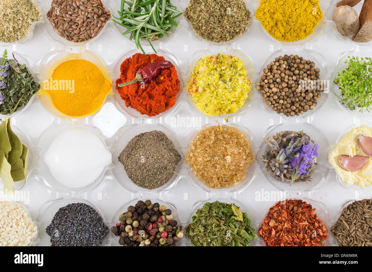 Ultimate spice collection ordered in round bowls Stock Photo - Alamy