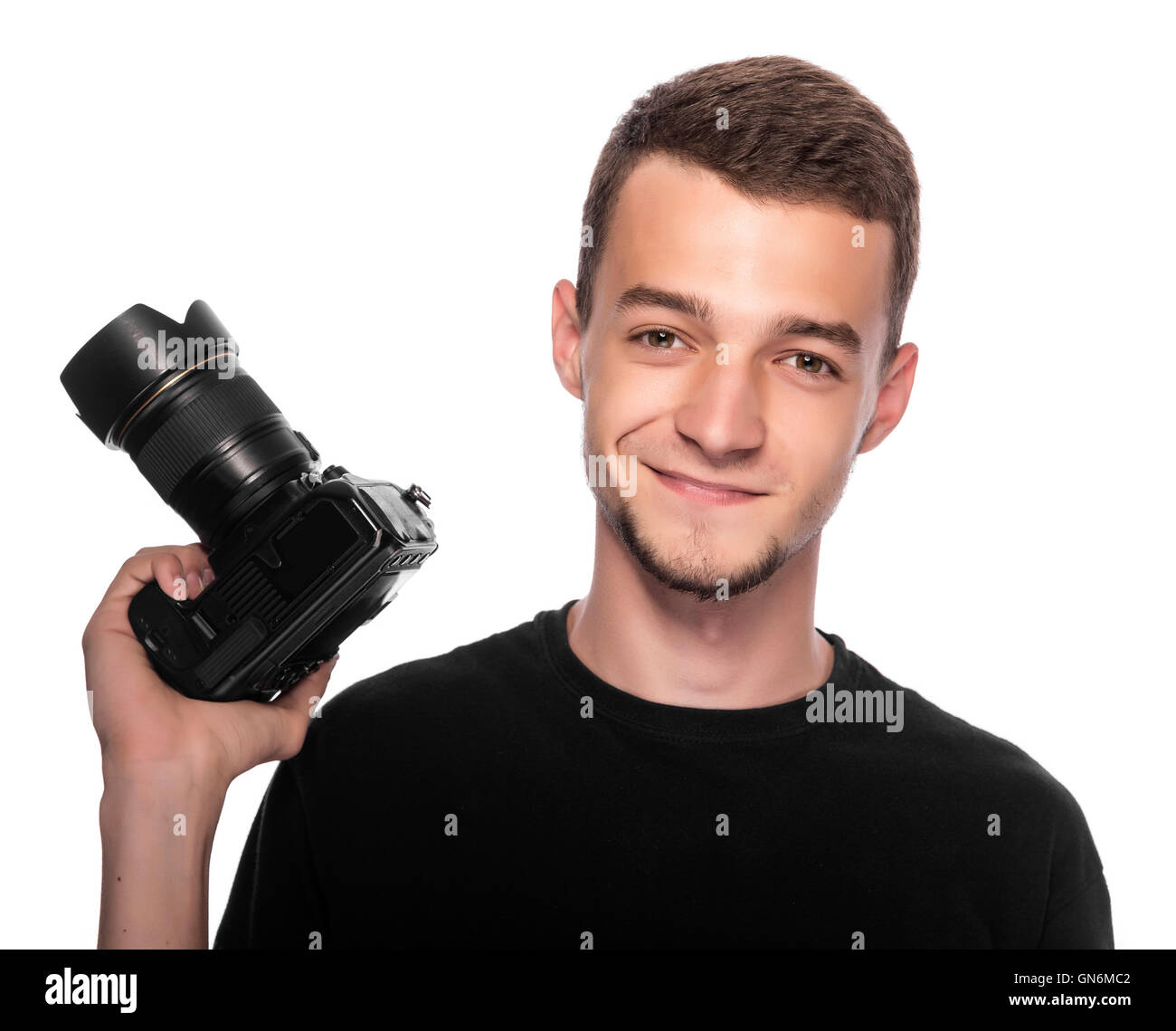 Handsome young man holding a DSLR camera. On white Stock Photo - Alamy