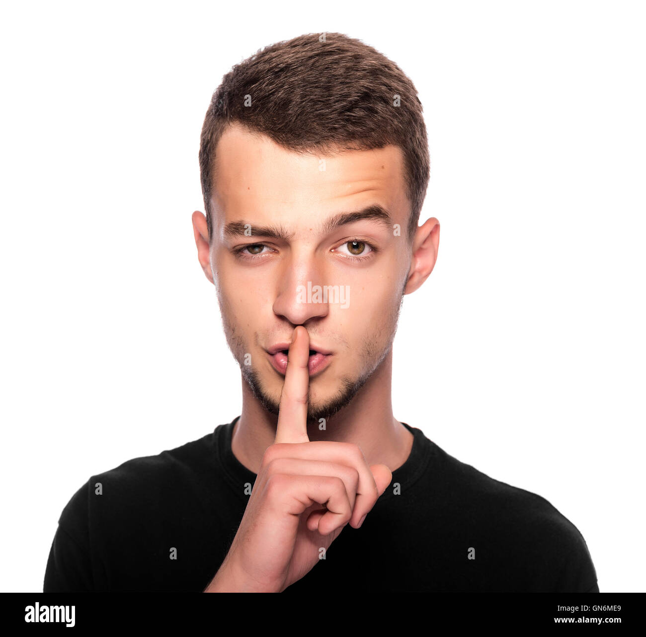Man gesturing silence, quiet, on white background Stock Photo - Alamy