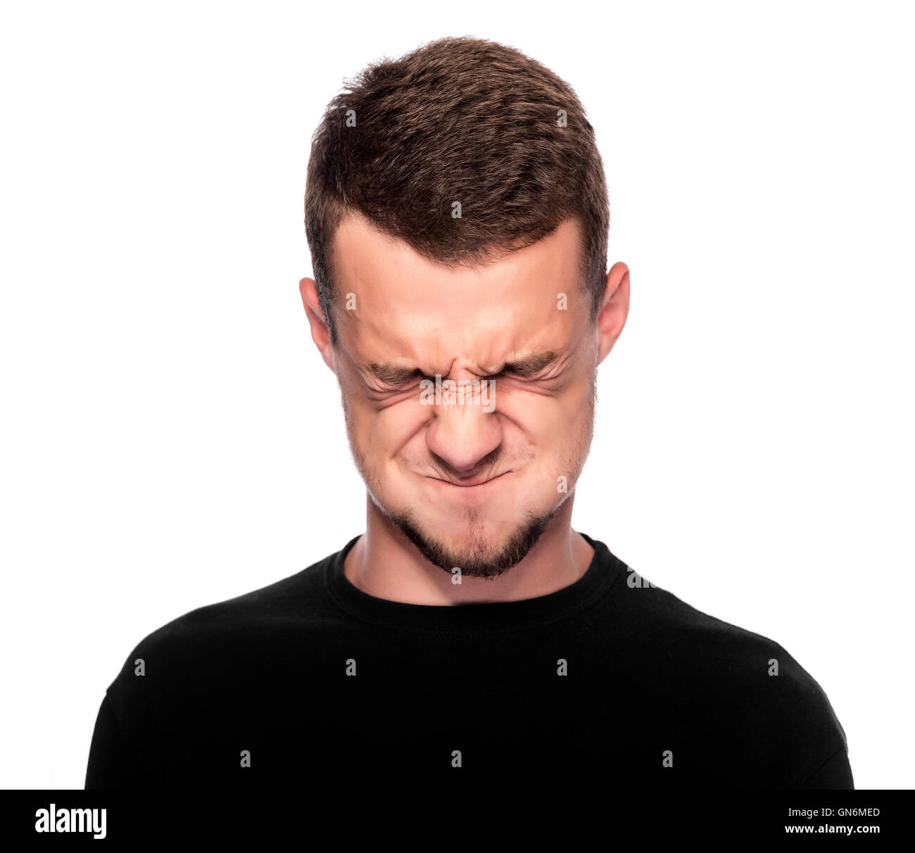 Stressful young man isolated on white background Stock Photo - Alamy