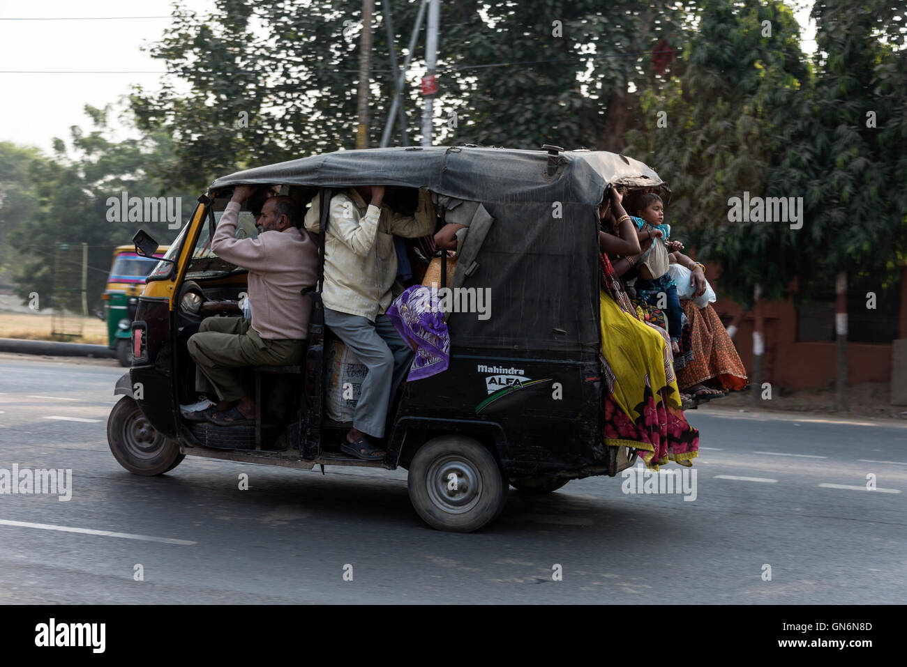 An overcrowded tut-tut of passengers on the main road in Agra in Uttar ...