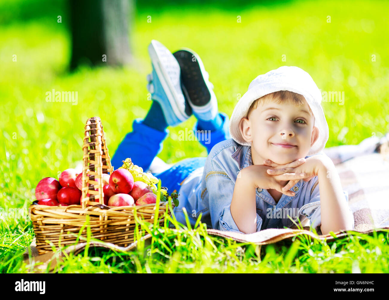 happy boy having a picnic in the summer park Stock Photo - Alamy