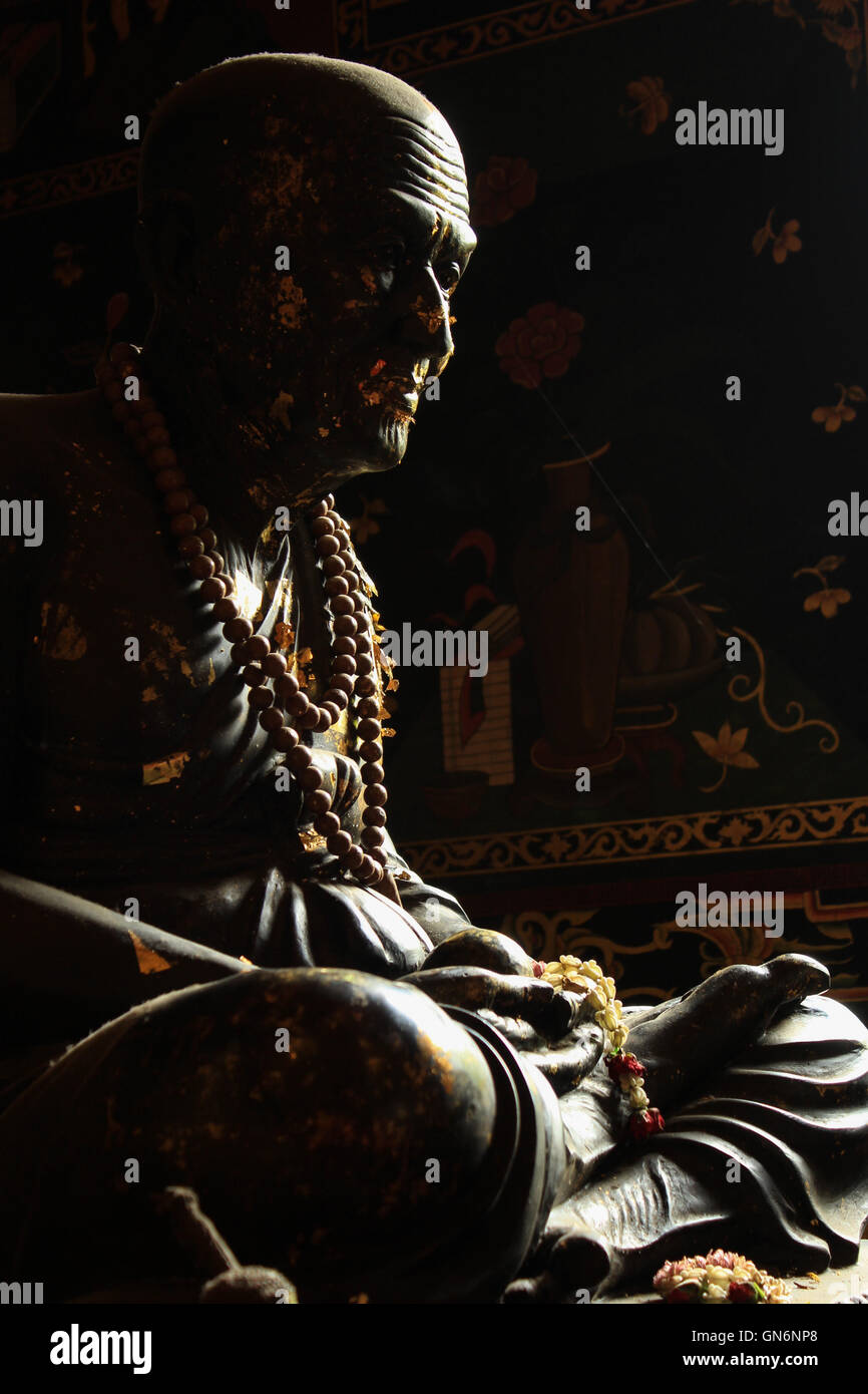 buddha statue with window light at thai temple Stock Photo - Alamy