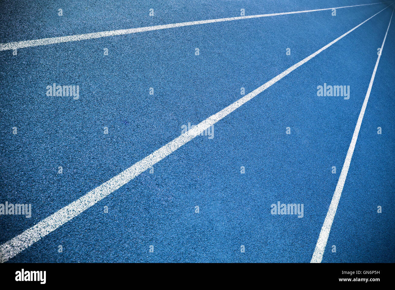 Blue lanes on a running track Stock Photo - Alamy