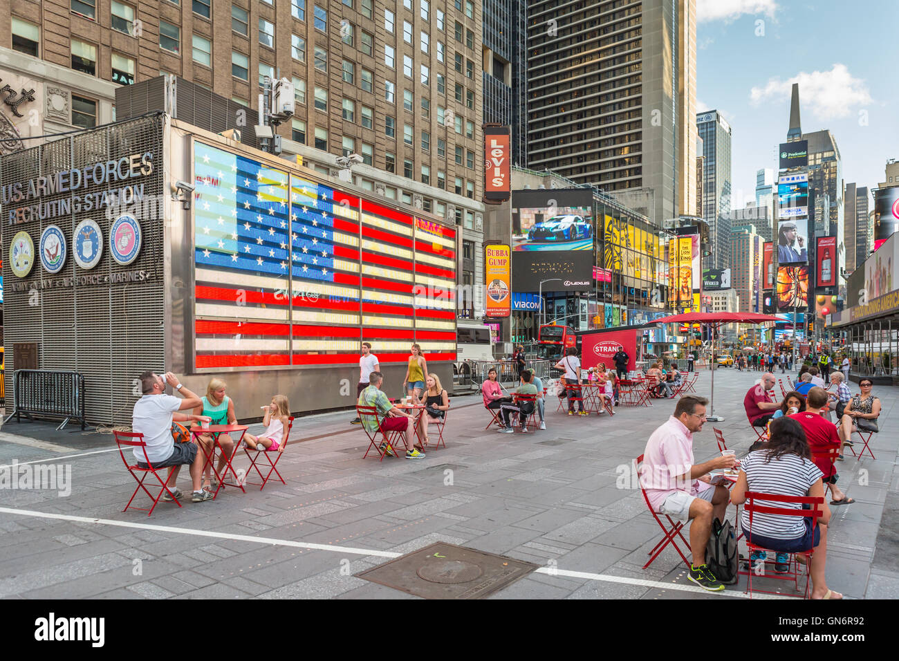 People enjoy the seating in the pedestrian plazas in Times Square early ...