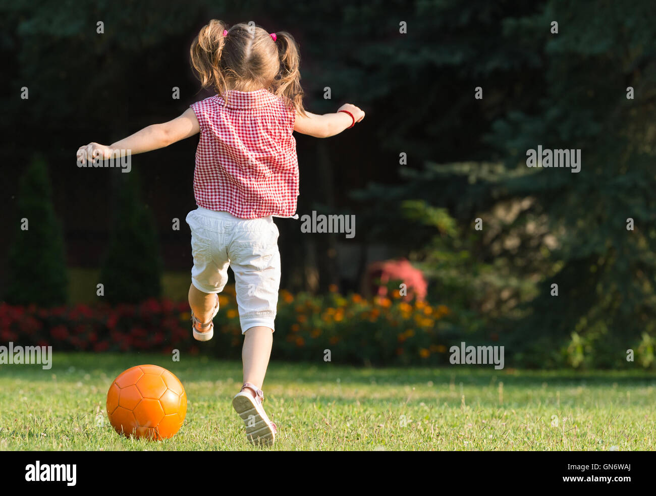 Little girl Shooting at Goal Stock Photo - Alamy