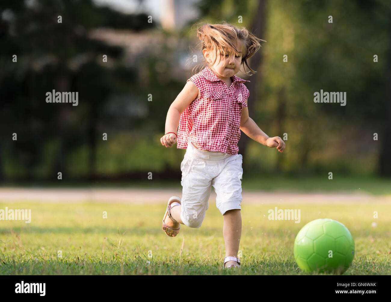 Little girl Shooting at Goal Stock Photo - Alamy