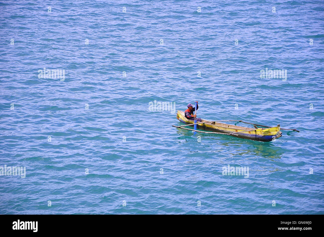 fisherman rowing boat Stock Photo - Alamy