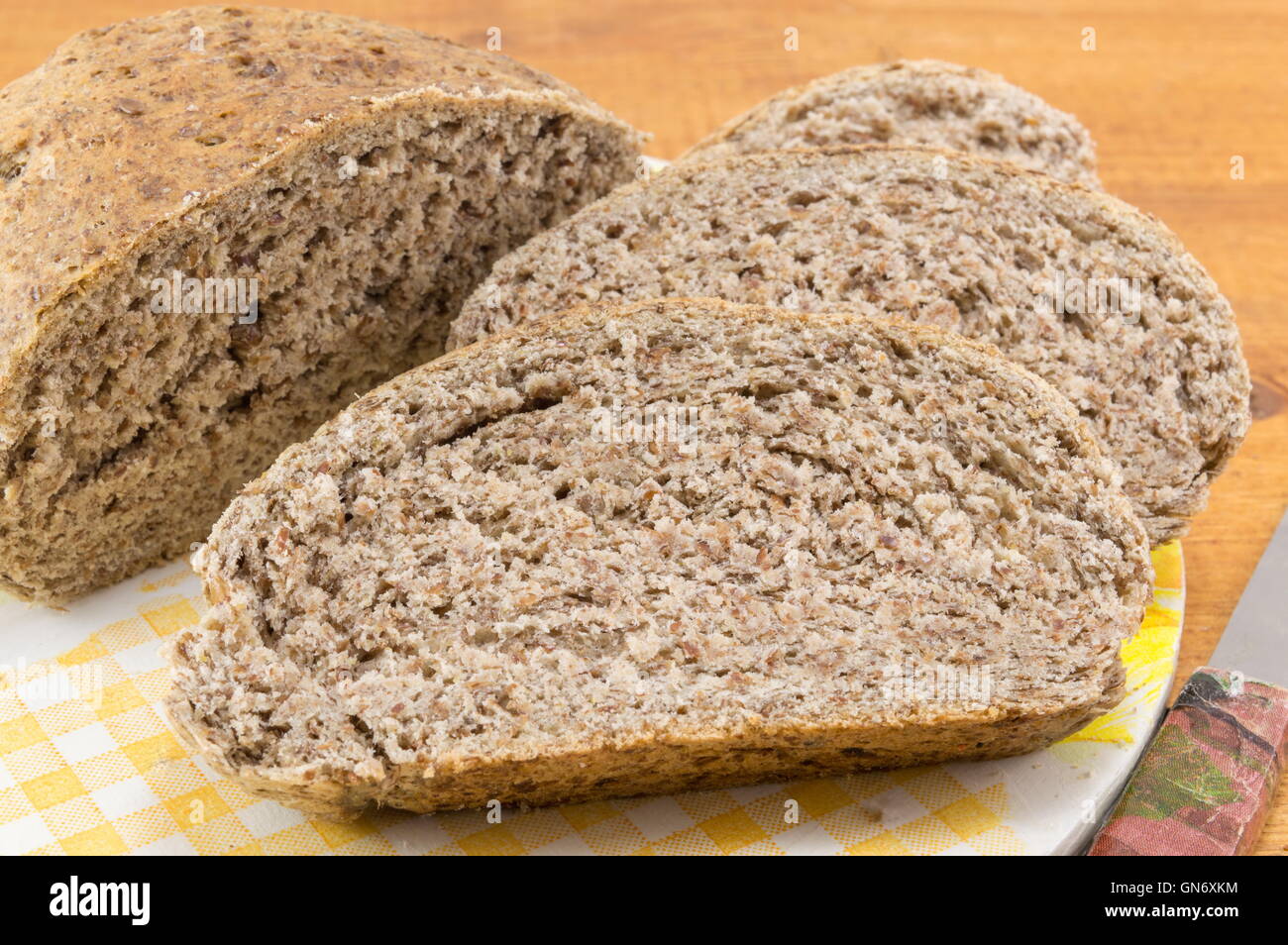 Home baked brown bread slices on the wooden table Stock Photo - Alamy