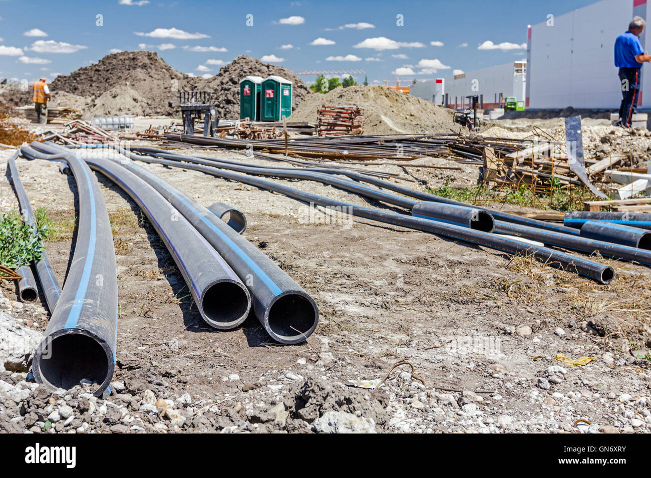 View on construction site with machinery, people at work. Landscape ...