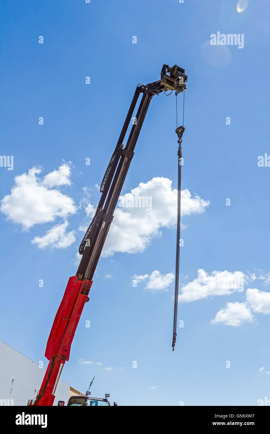 Telescopic mobile crane has high elevated chains for lifting hook ...