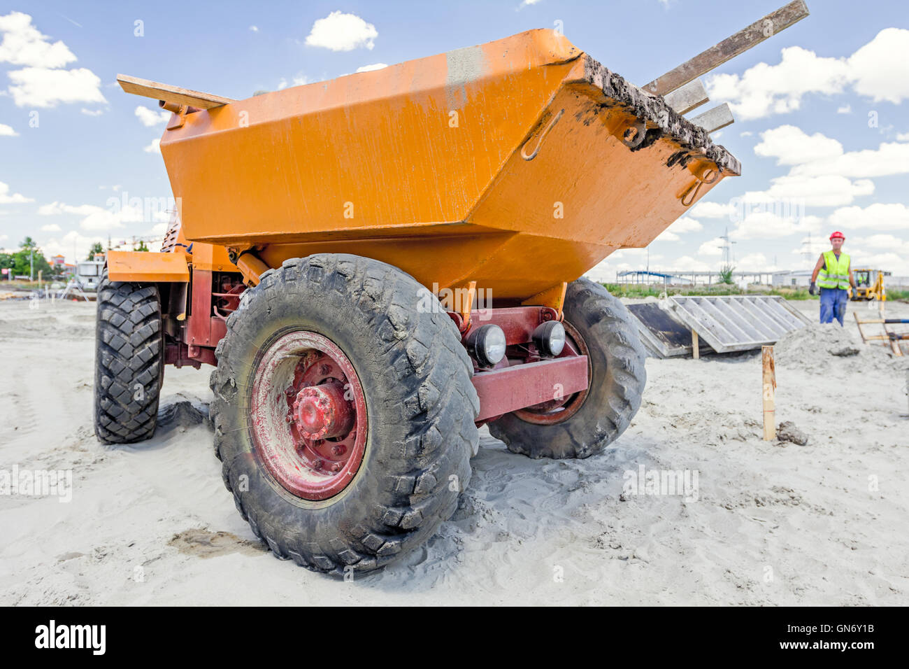 Little construction dumper carrier is at building site Stock Photo - Alamy