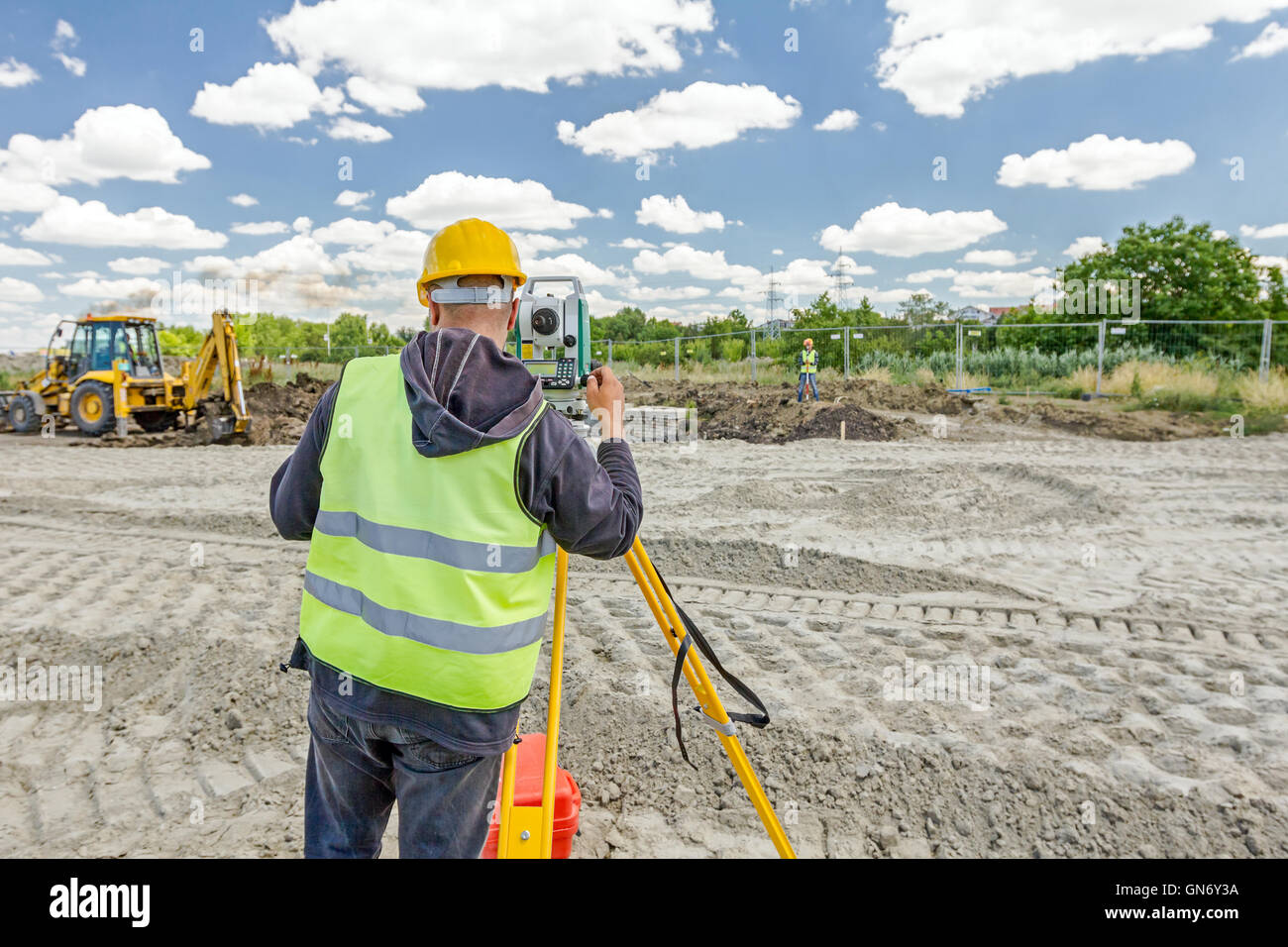 Surveyor engineer is measuring level on construction site. Surveyors ...