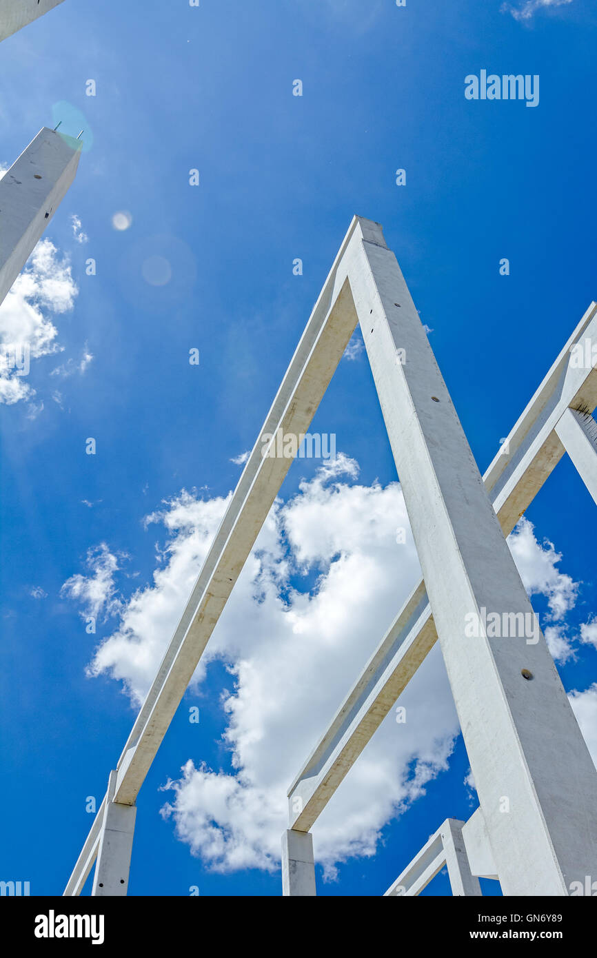 Perspective view of concrete pillars, edifice in progress of growing ...