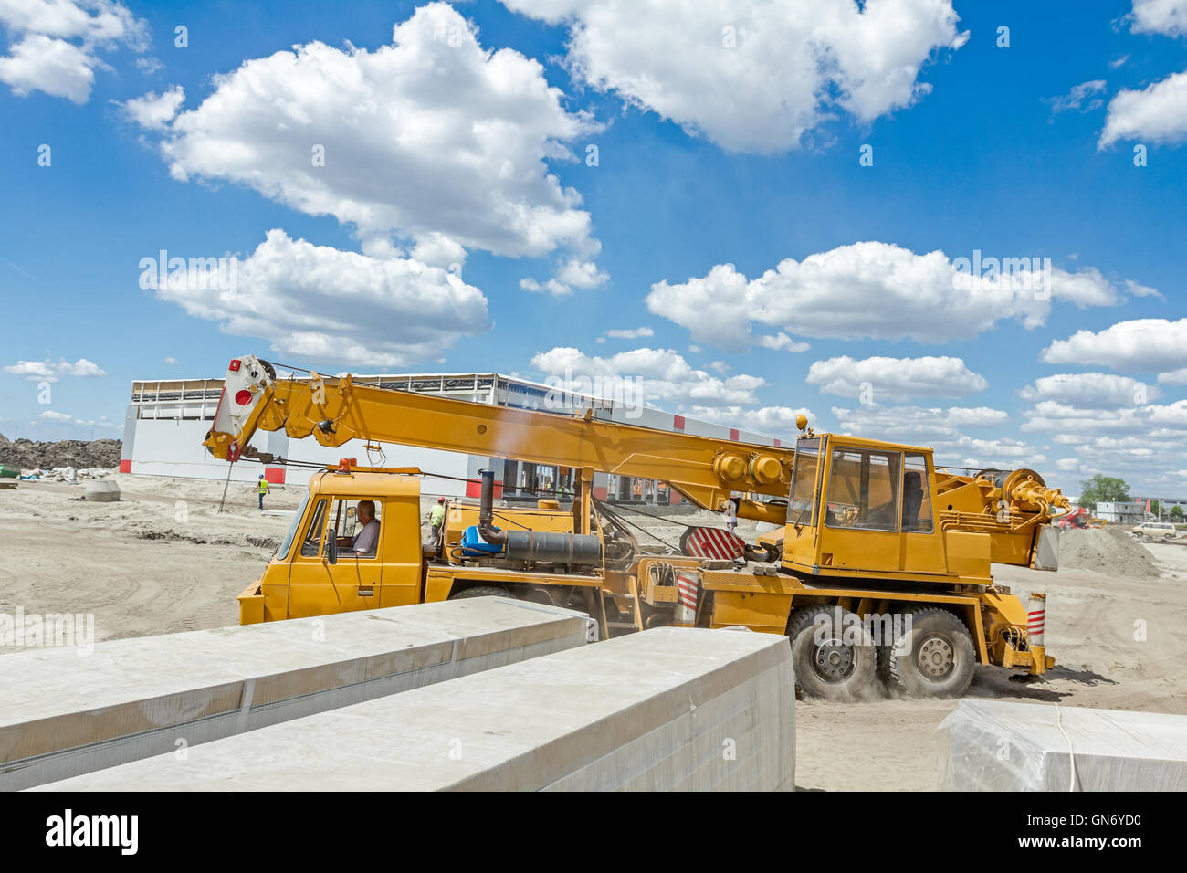 View on construction site with machinery, people at work Stock Photo ...