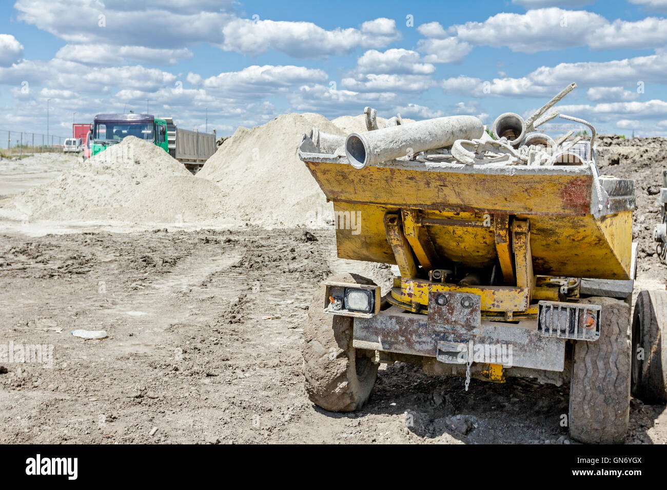 Little construction dumper carrier is at building site Stock Photo - Alamy