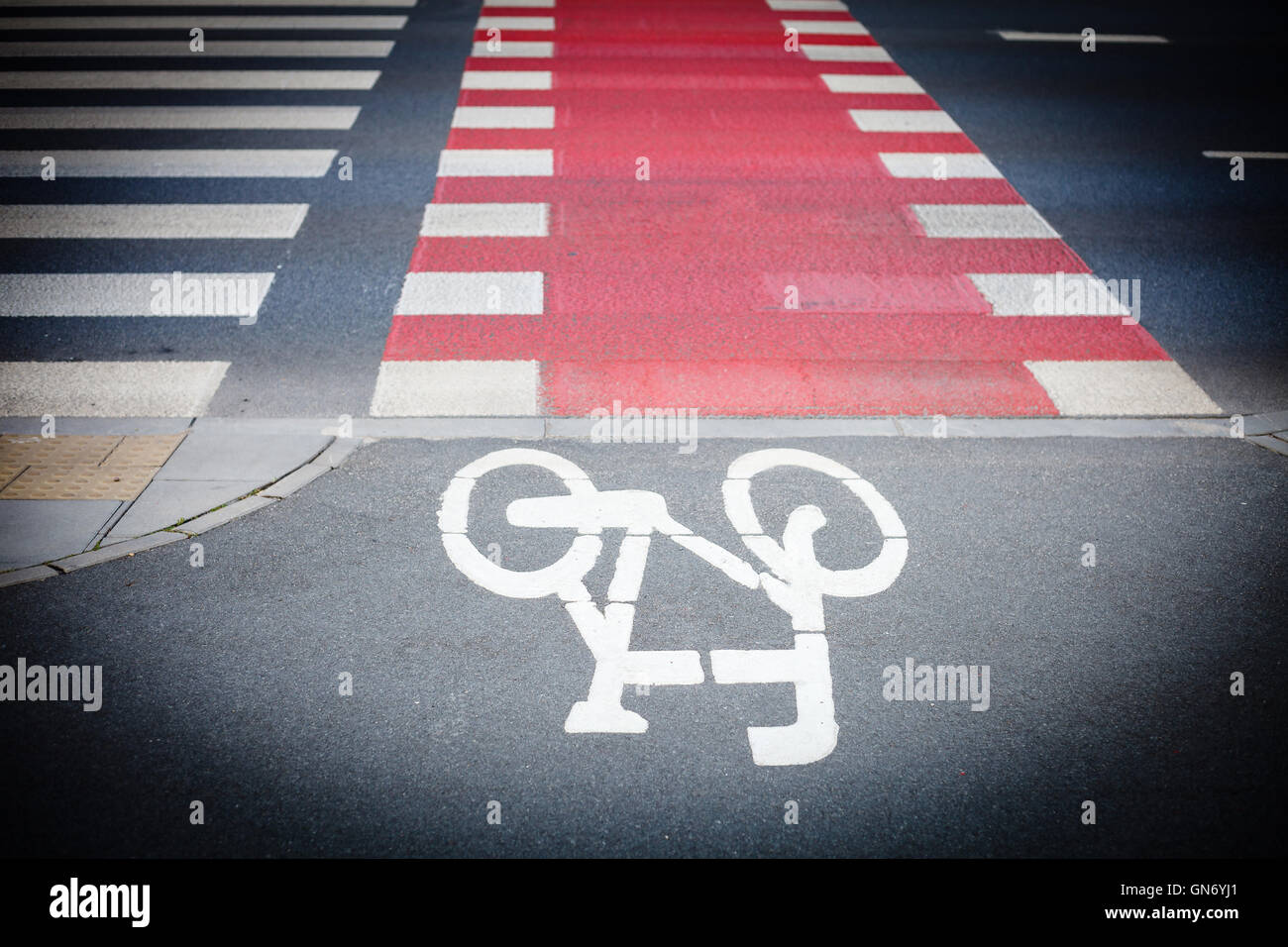 Bike path crossing road Stock Photo - Alamy
