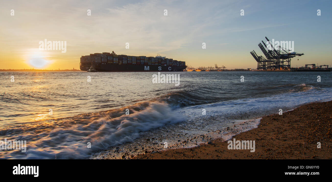 A container vessel preparing to dock at port Stock Photo - Alamy
