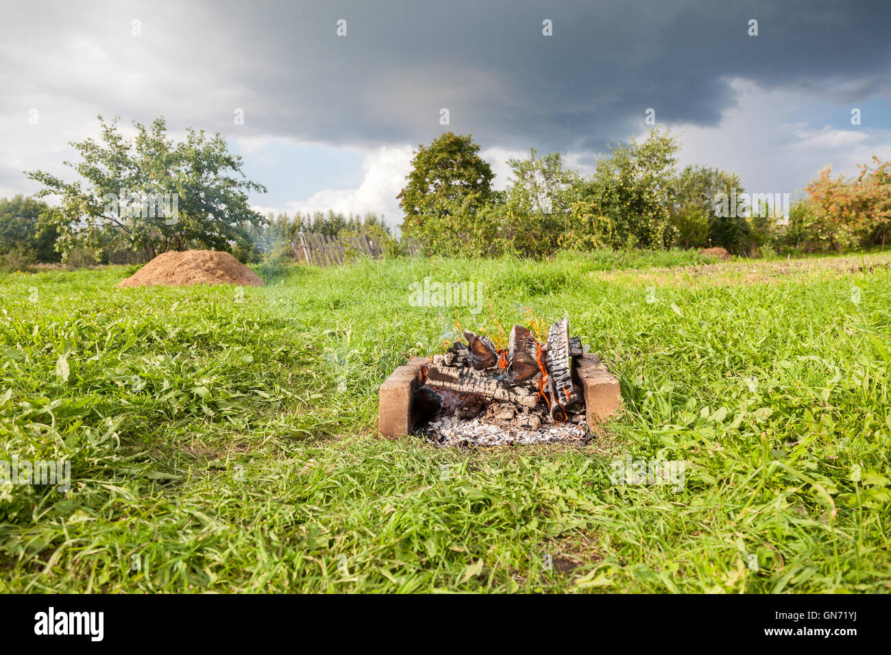 Warm fire burning in a campfire at the outdoors in summertime Stock ...