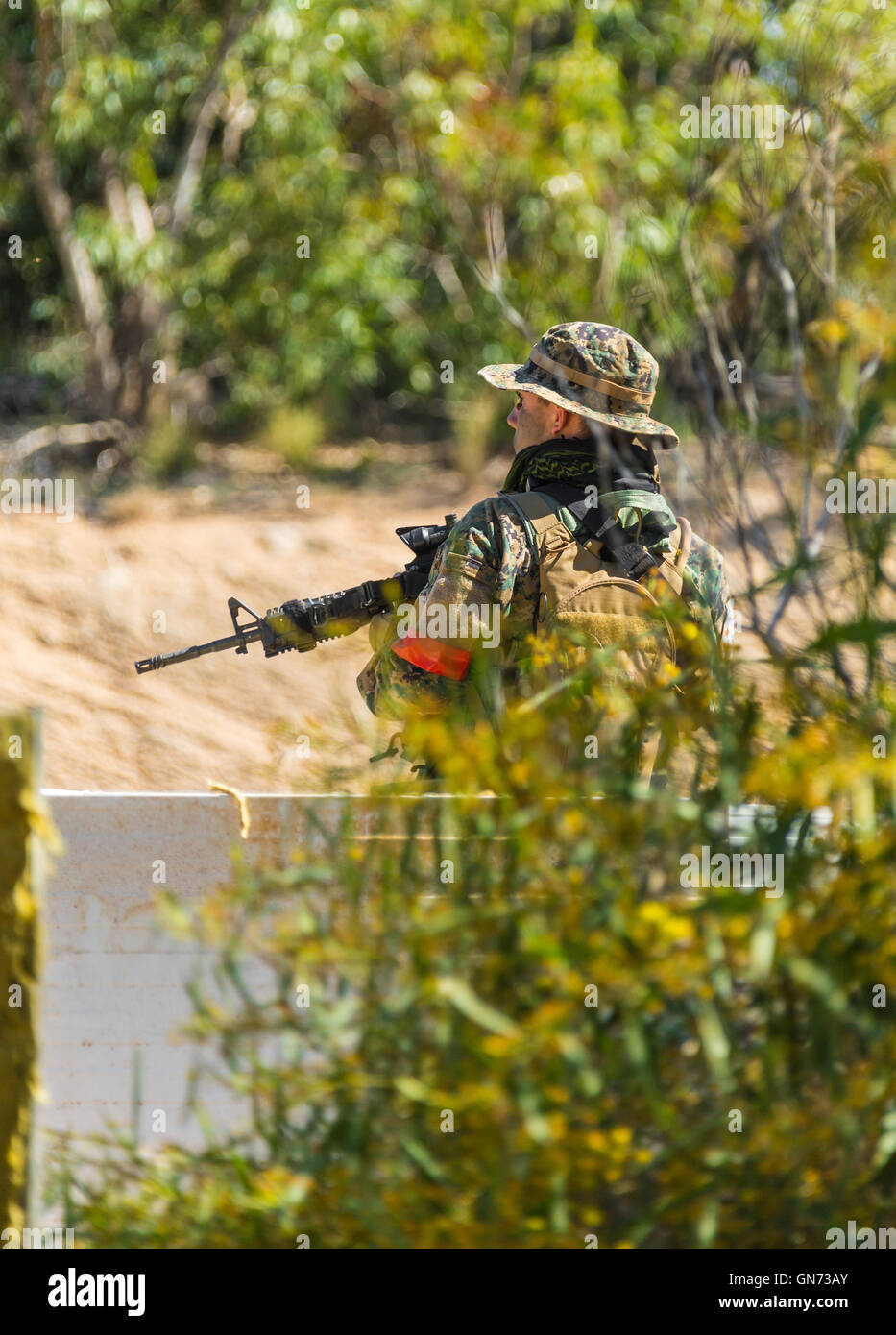 soldier in uniform with weapon on a mission Stock Photo - Alamy