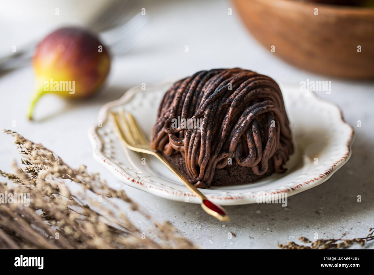 Chocolate Mont Blanc by cup of tea and fresh Figs Stock Photo - Alamy