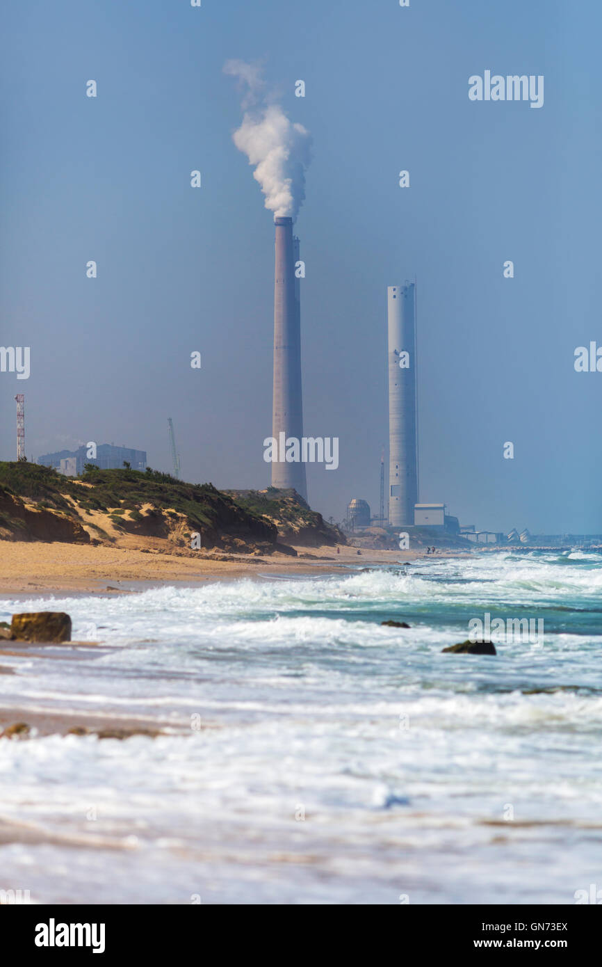 smokestack pipe factory on the shore of blue sea Stock Photo - Alamy