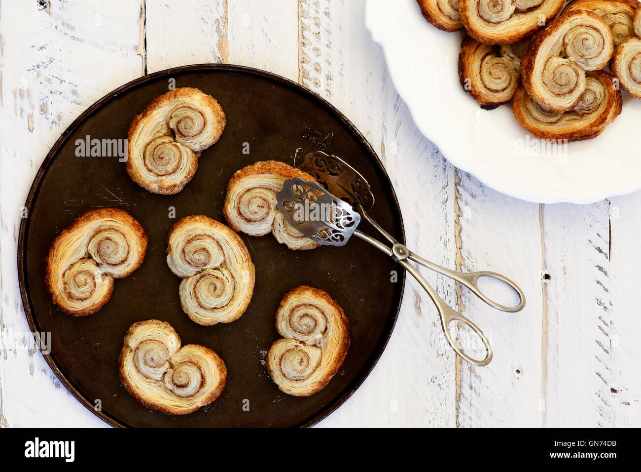 Palmier biscuits or french pastry made of puff pastry and cinnamon are ...