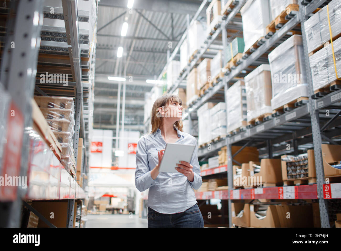 beautiful young furniture store store worker stock taking Stock Photo ...