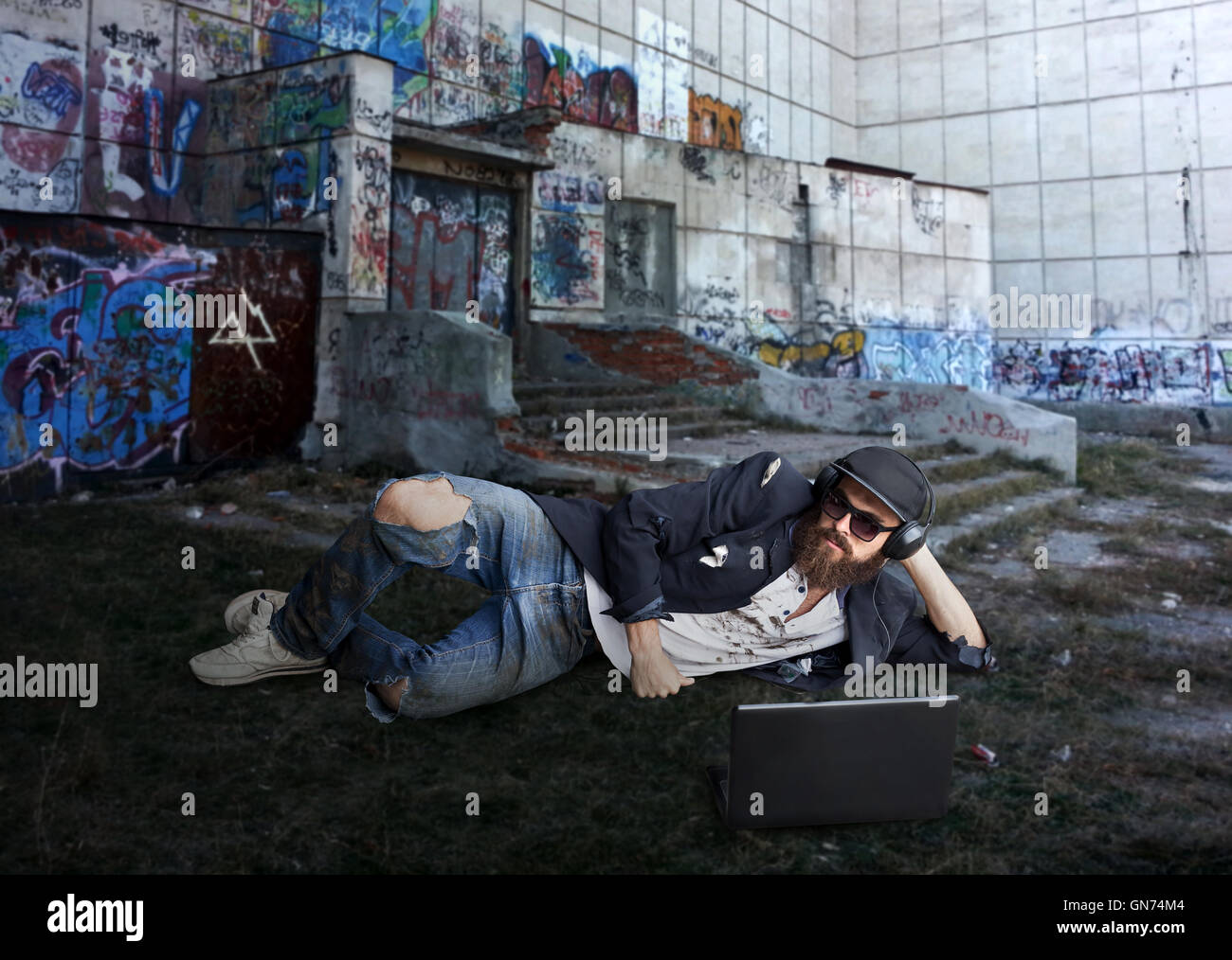 Vagrant with computer Stock Photo - Alamy
