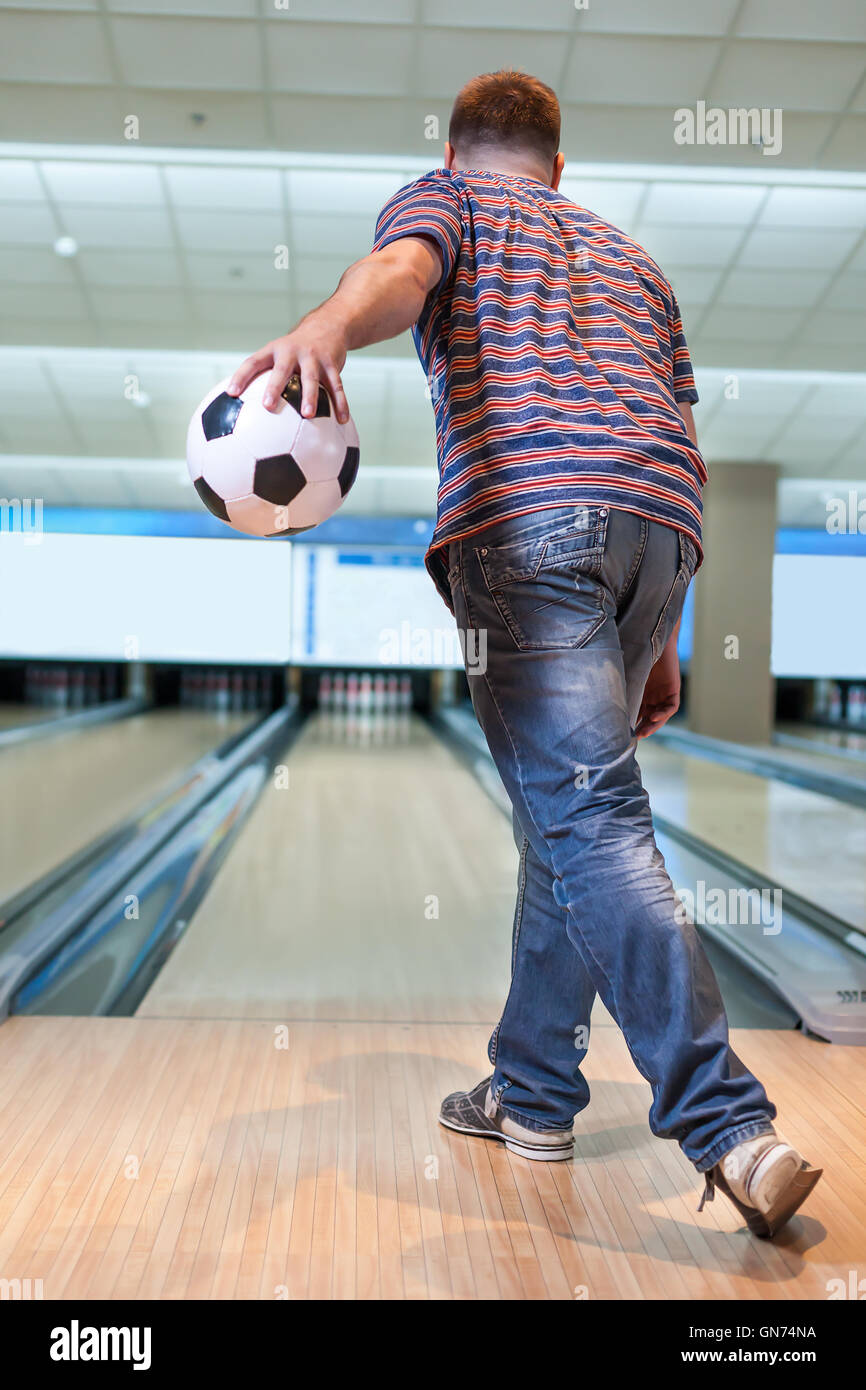 Man playing bowling Stock Photo - Alamy