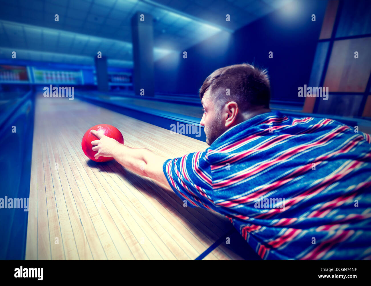 Man lying on the floor Stock Photo - Alamy
