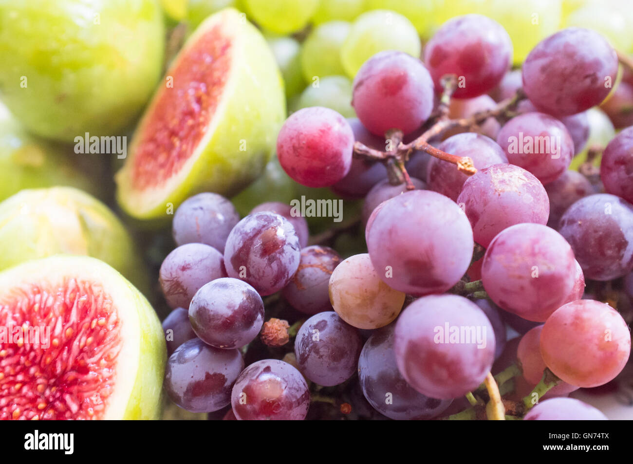 Fresh figs and grape Stock Photo - Alamy