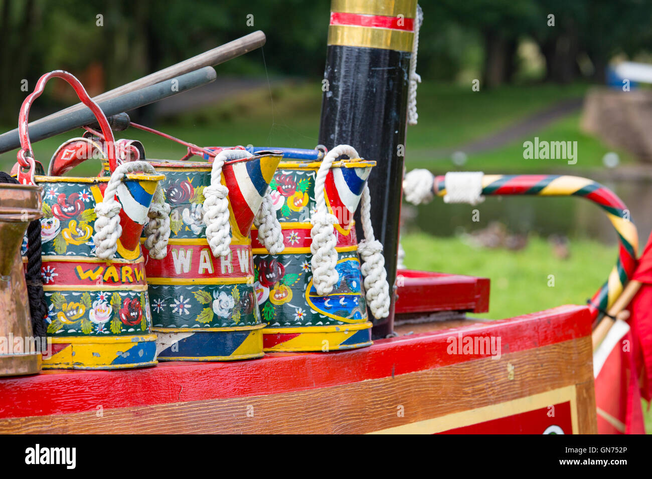 Colourfull traditional Buckby Can painting on a narrowboat, England, UK ...