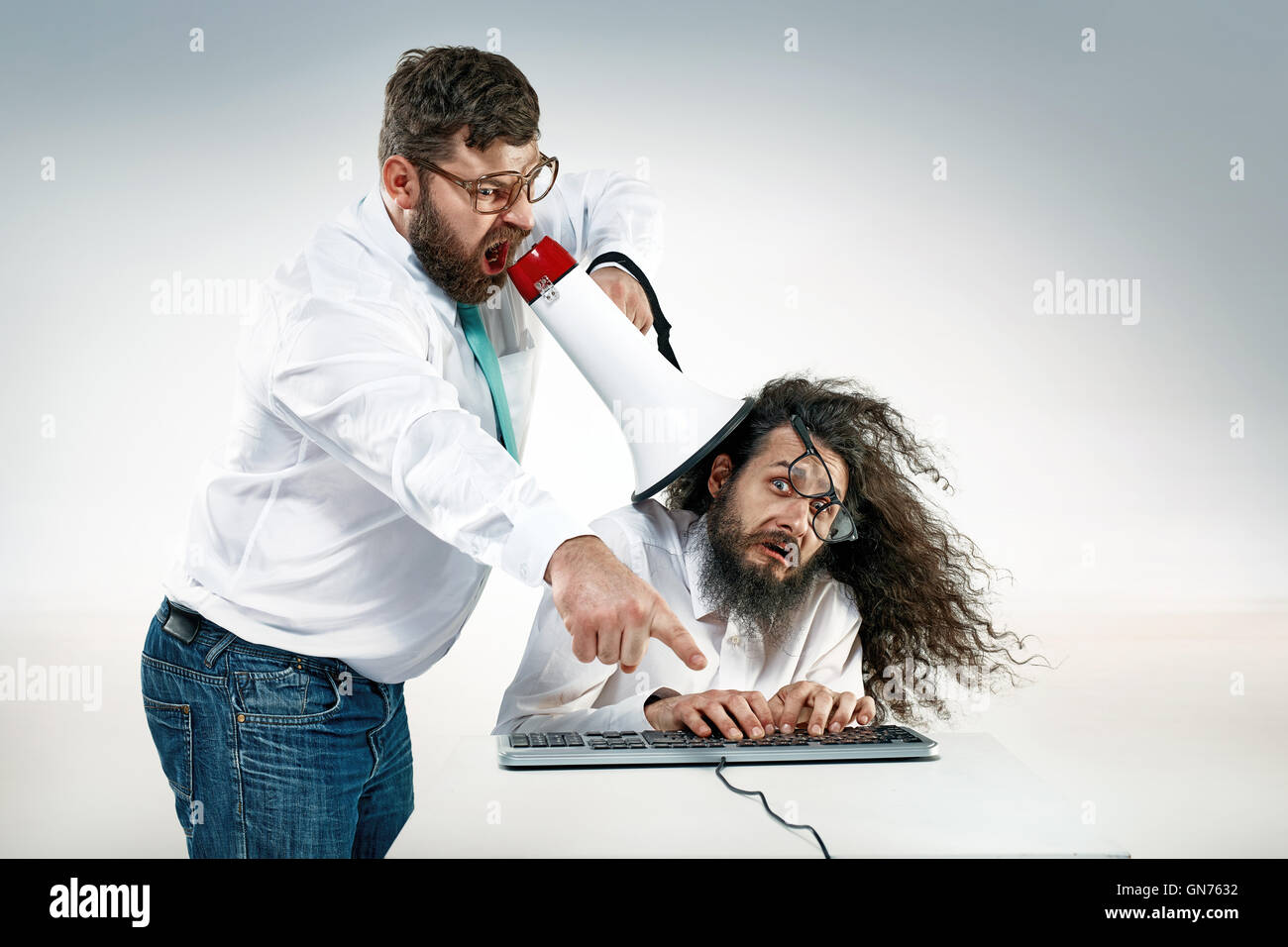 Angry boss yelling to an office employee Stock Photo - Alamy