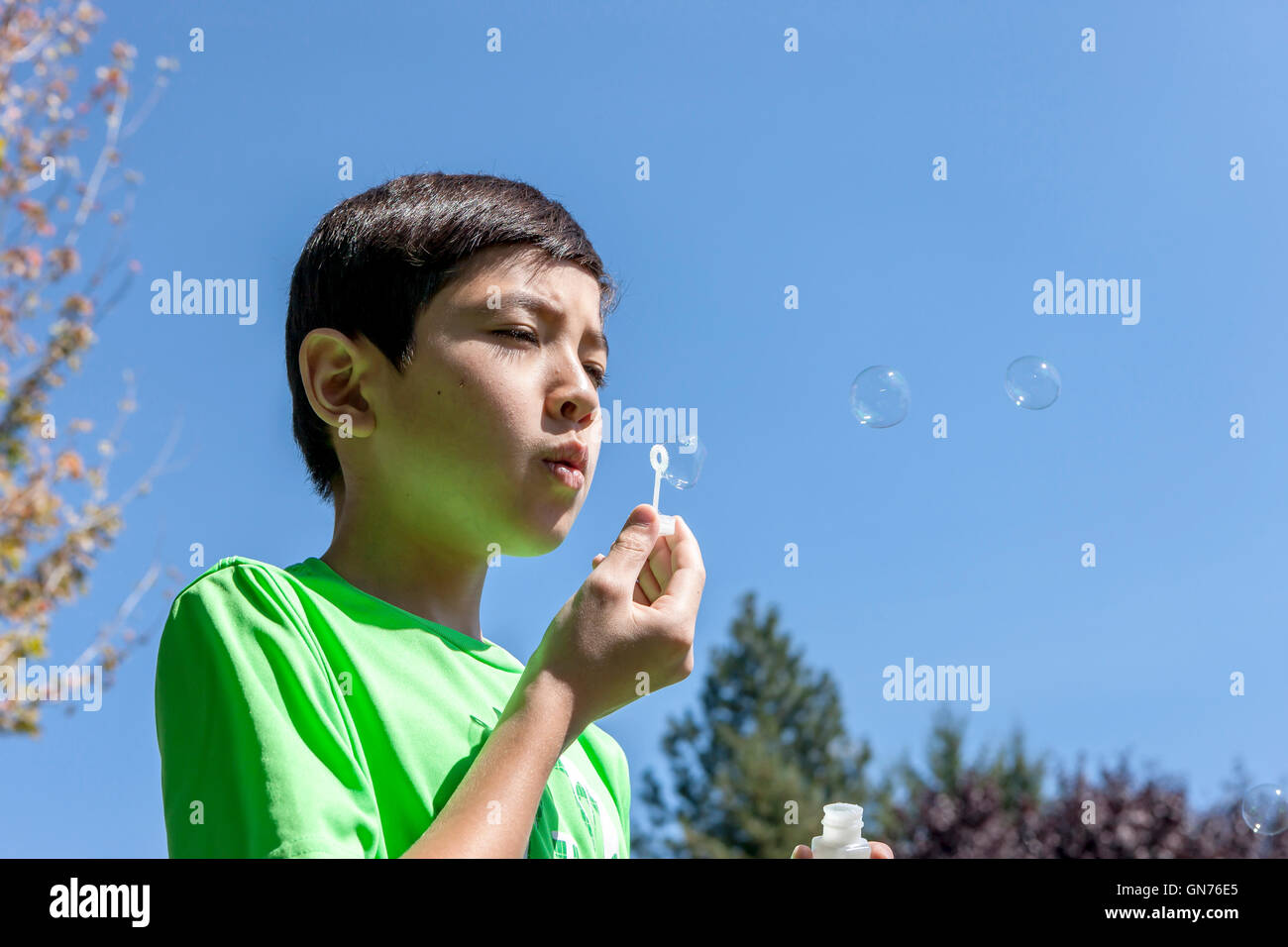 Blowing bubbles outside Stock Photo - Alamy