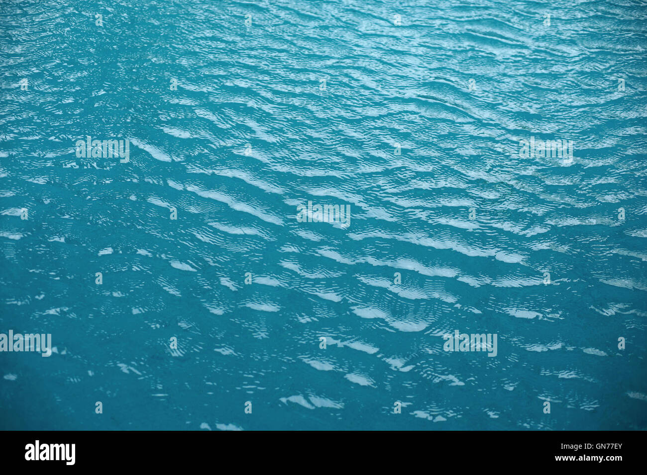 blue ripped water in swimming pool as background Stock Photo - Alamy