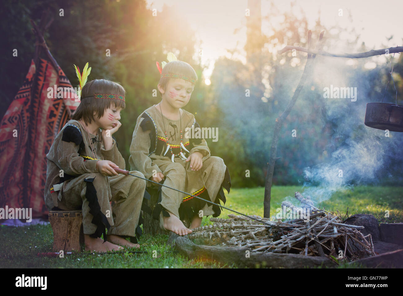 Cute portrait of native american boys with costumes, playing outdoor ...