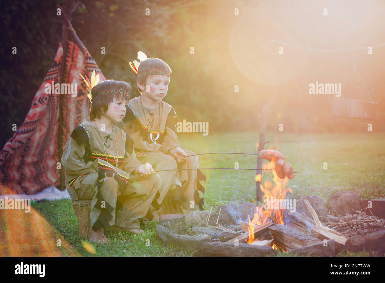 Cute portrait of native american boys with costumes, playing outdoor ...