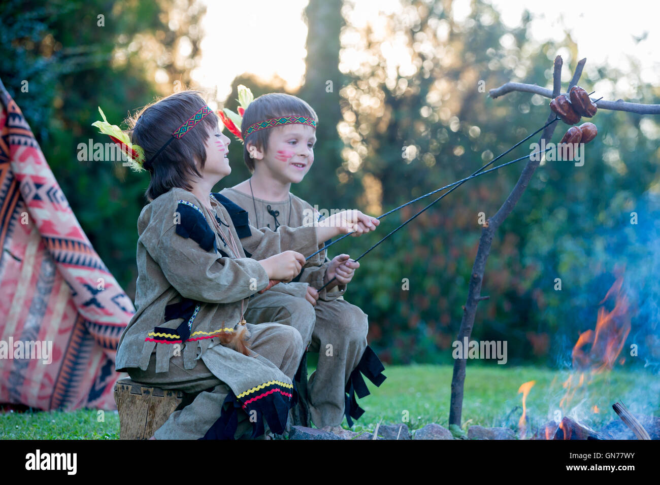 Cute portrait of native american boys with costumes, playing outdoor ...