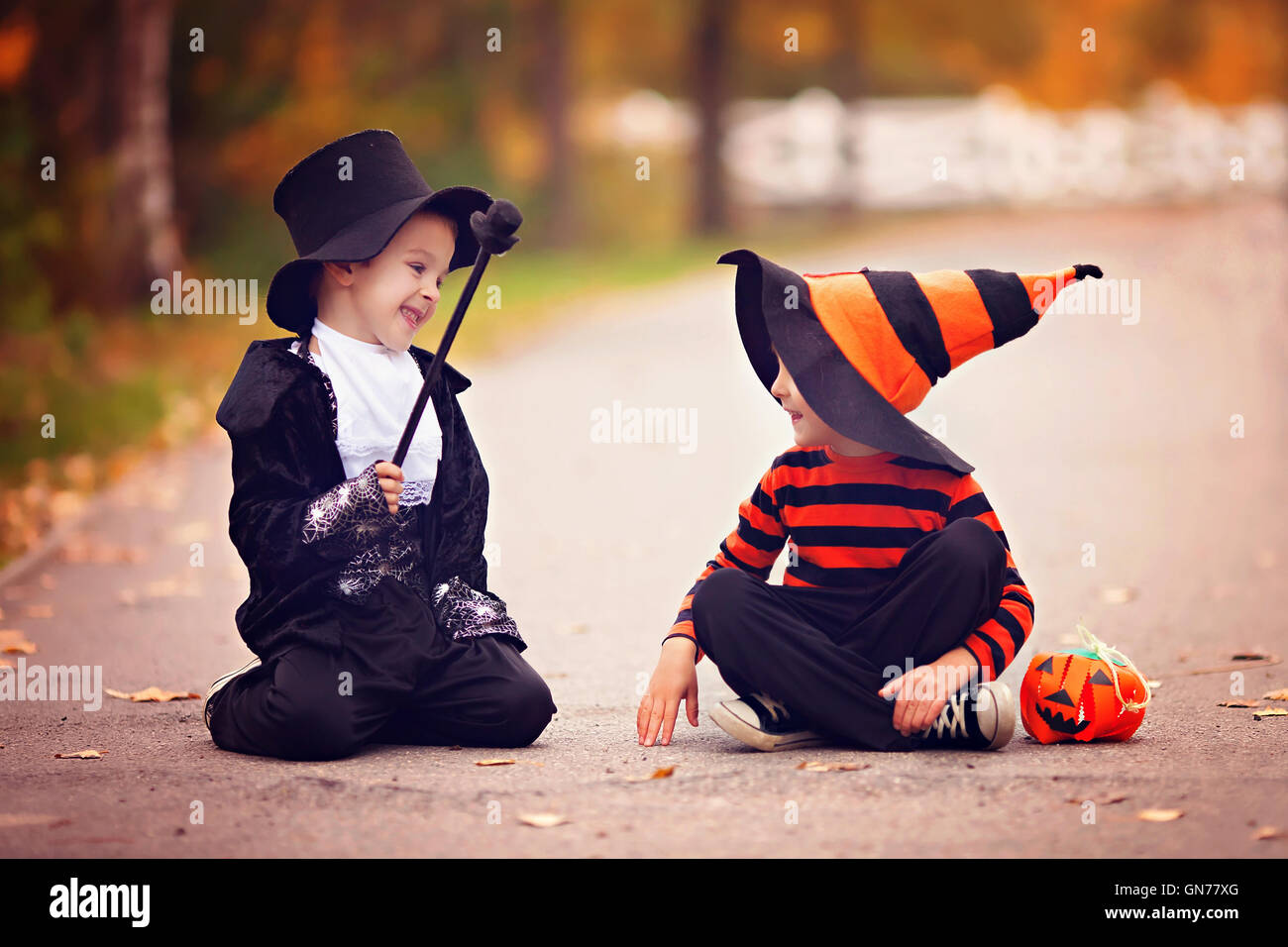 Two boys in the park with Halloween costumes, having fun Stock Photo ...