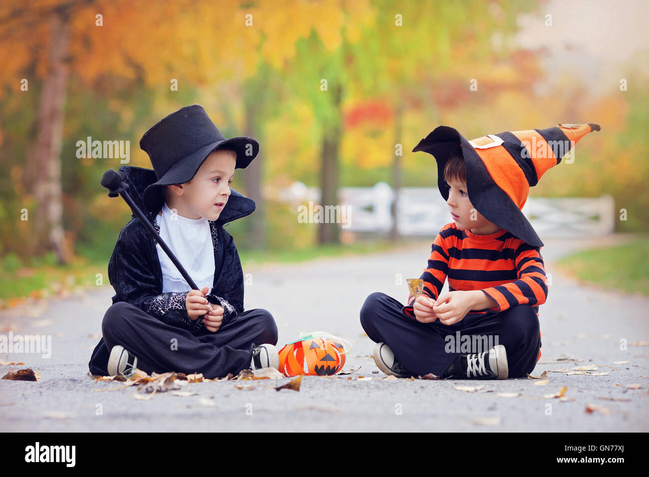 Two boys in the park with Halloween costumes, having fun Stock Photo ...