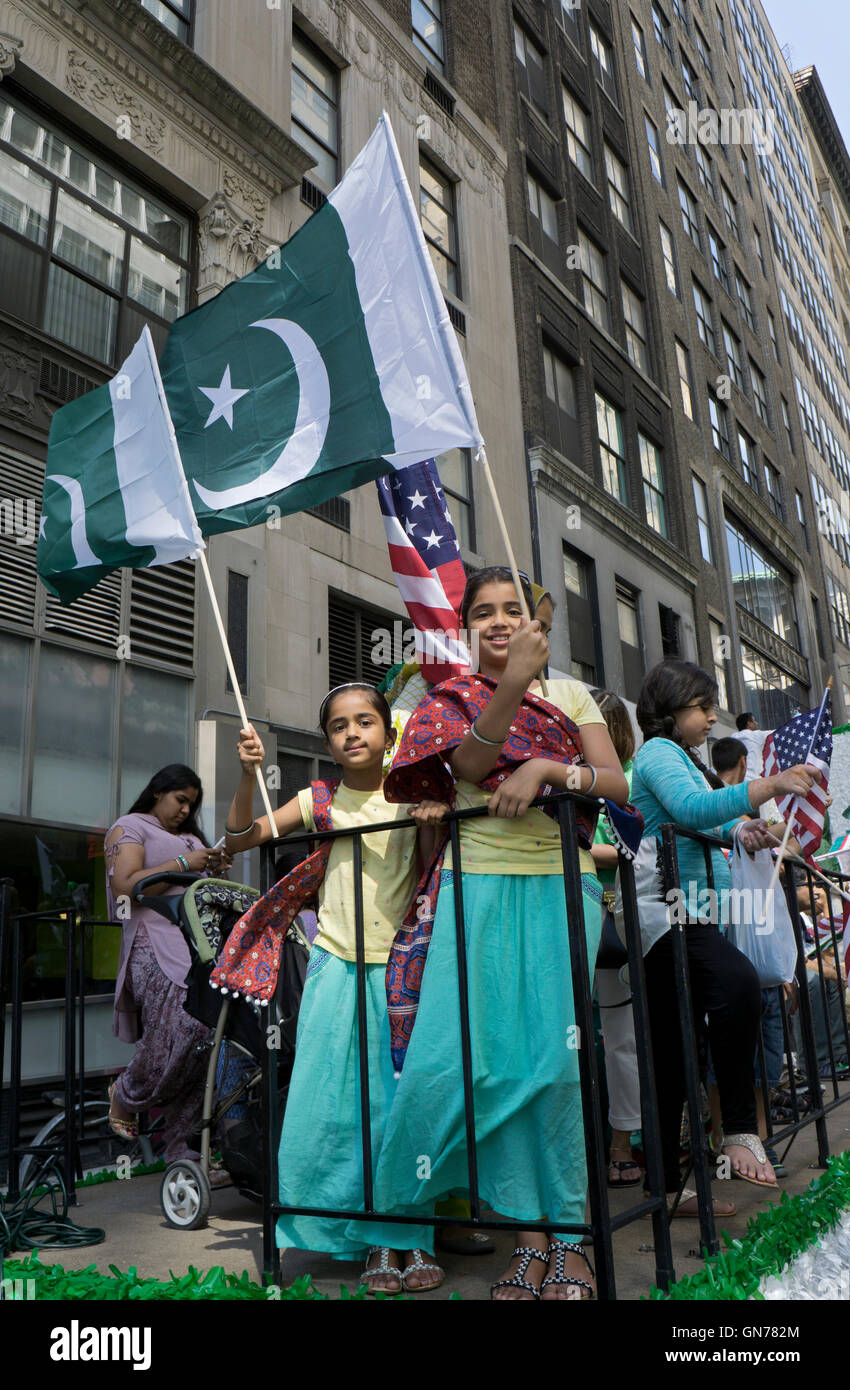 Pakistani sisters carrying flags on a float in the 2016 Pakistan Day ...